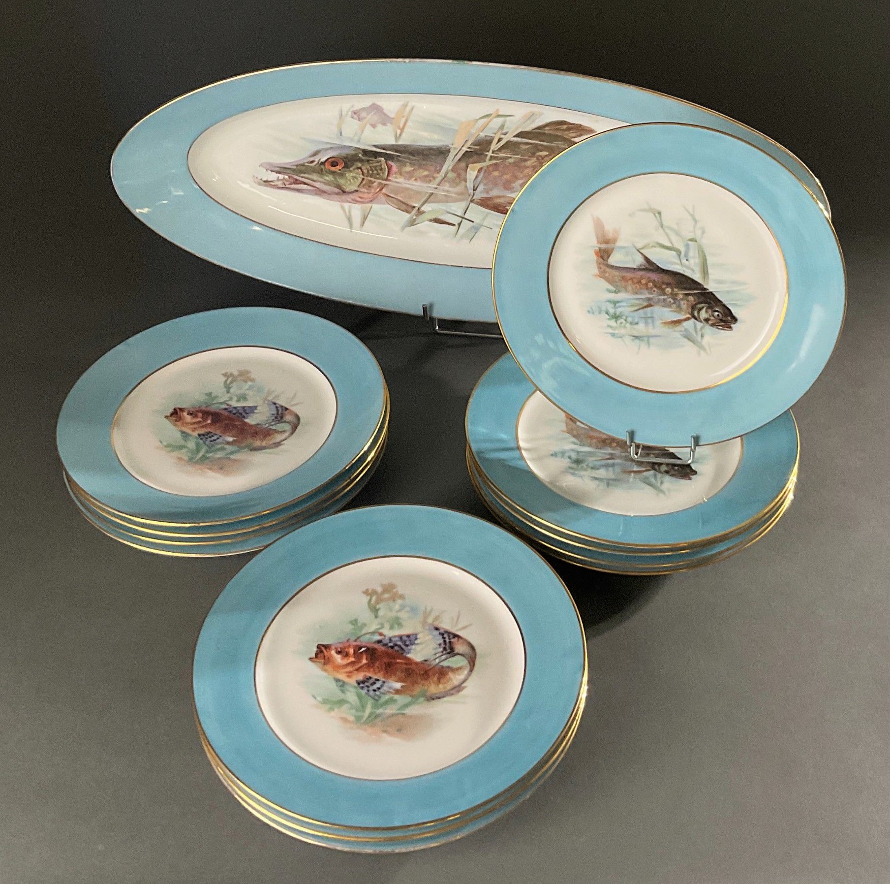 A set of 12 Limoges Fish Plates