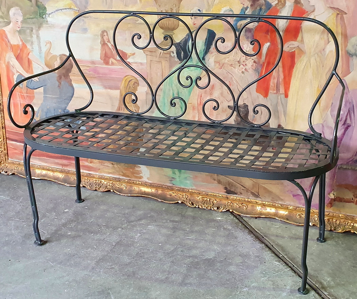 A Wrought Iron Garden Bench